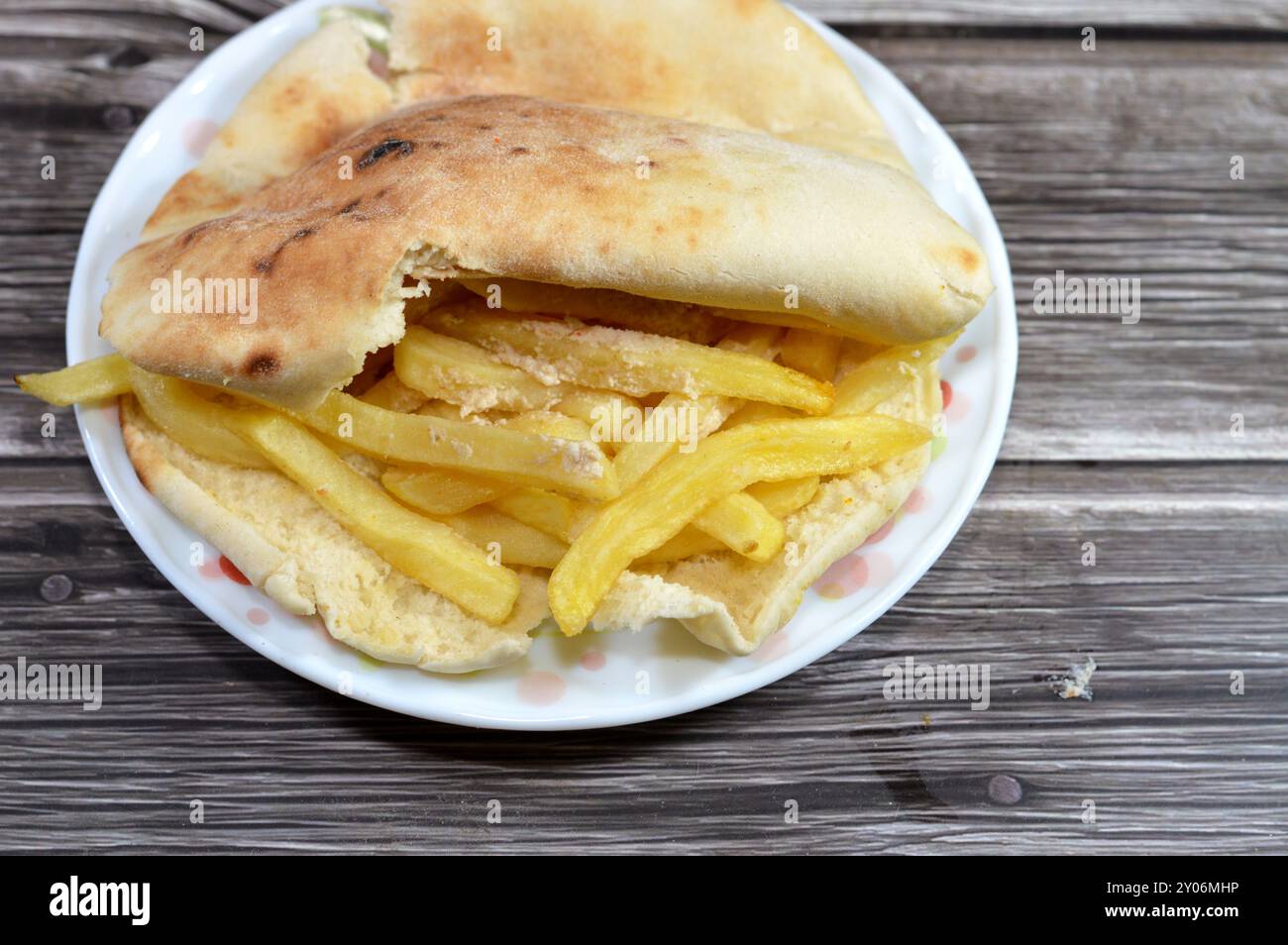 Potatoes with Tahini in Flat Shami Syrian bread filled with French ...