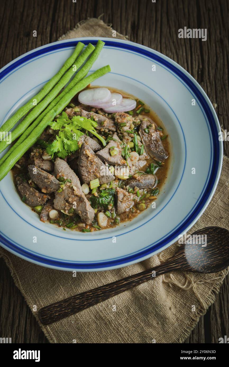 Spicy pig liver with vegetable, Thai food Stock Photo - Alamy