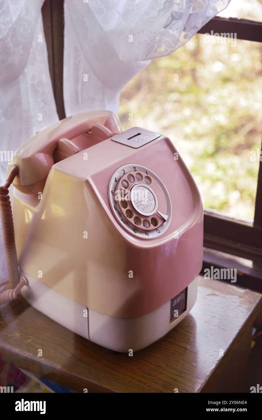 Cute pink vintage telephone at a booth in Japan Stock Photo - Alamy