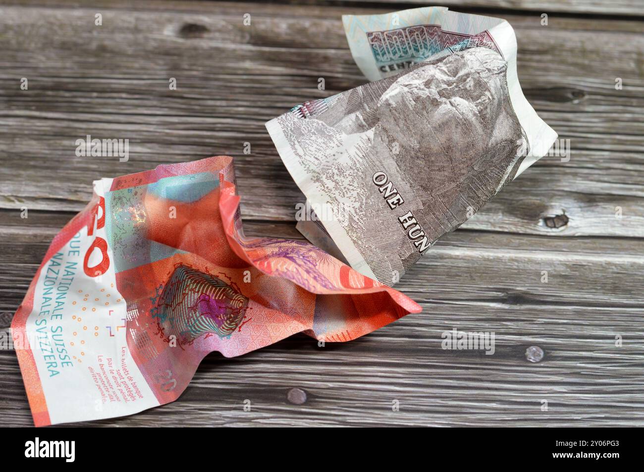 Wrinkled Egyptian pounds EGP LE, crumpled and folded Swiss francs CHF ...