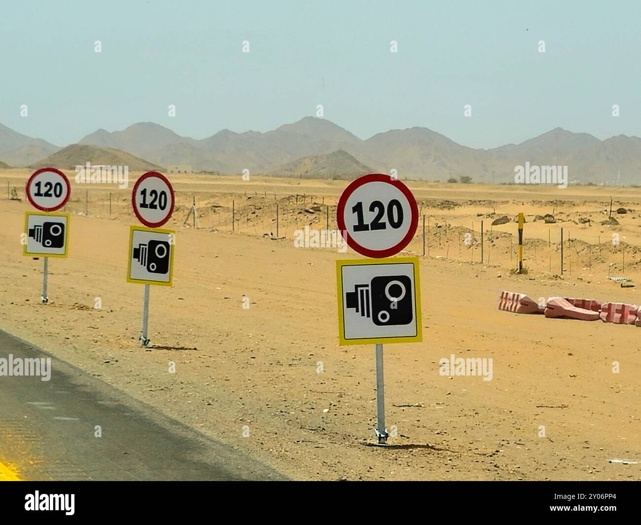 120 KM maximum speed limit sign with a speed camera road sign at Mecca ...