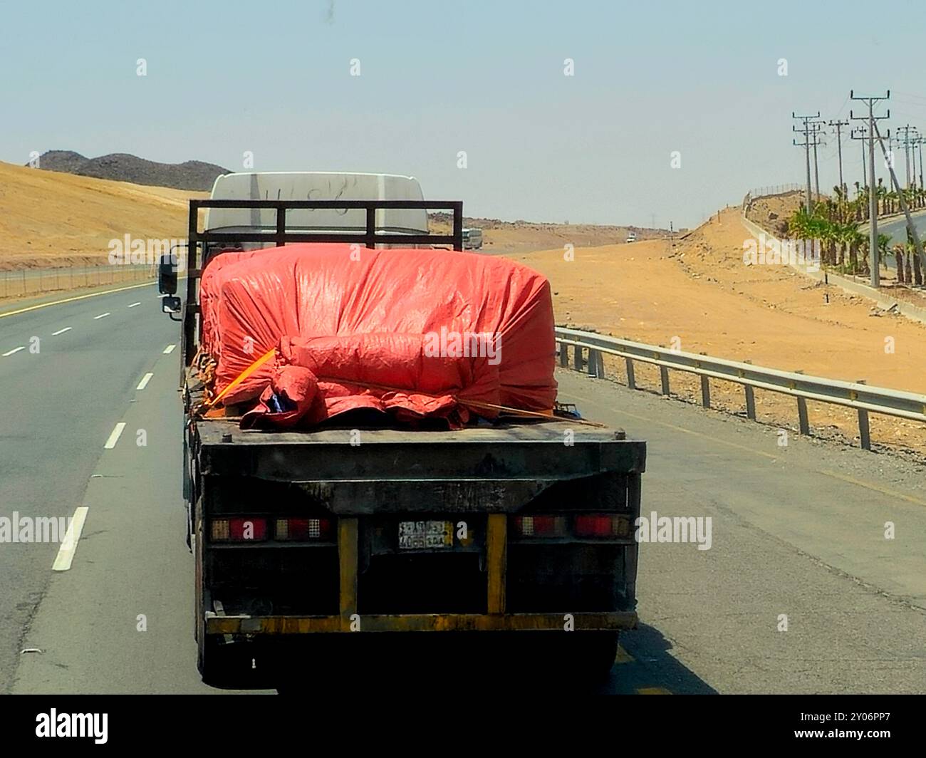 Makkah Madinah road, Saudi Arabia, June 25 2024: A big flatbed truck ...
