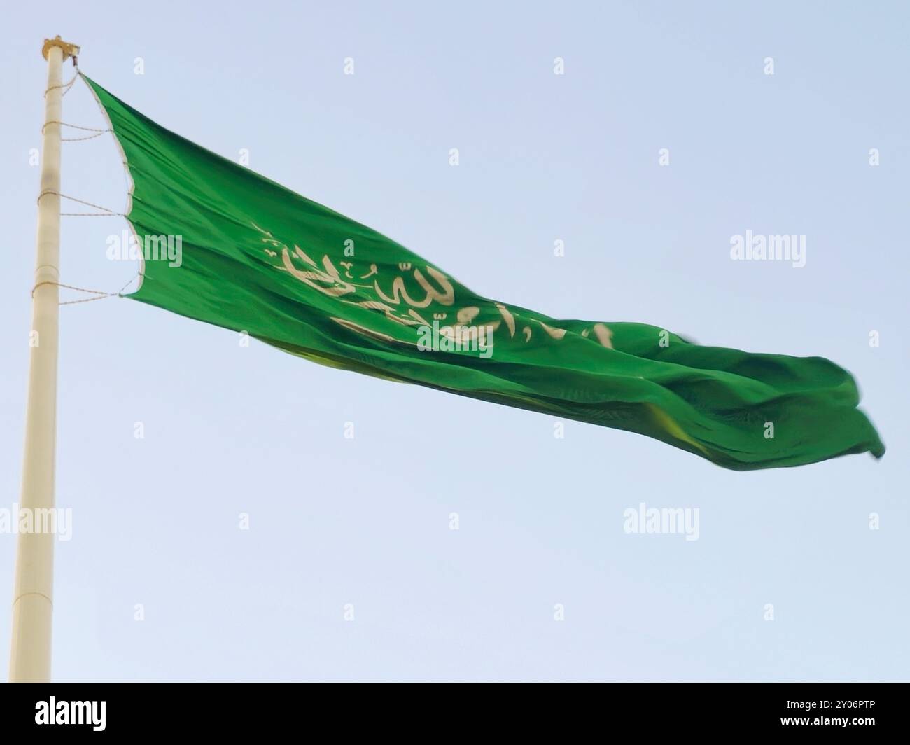 The national flag of Saudi Arabia kingdom, a green background with ...