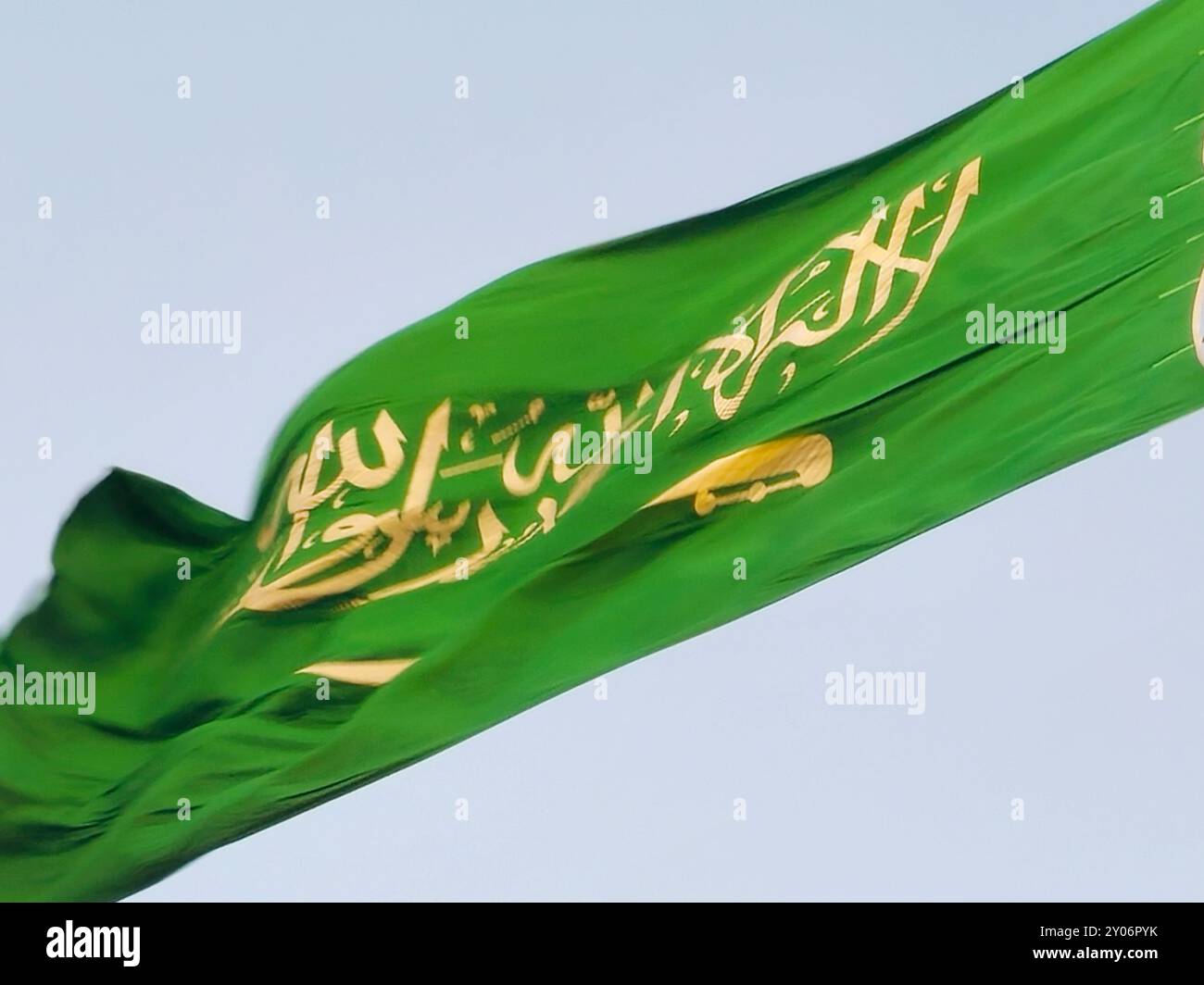 The national flag of Saudi Arabia kingdom, a green background with ...