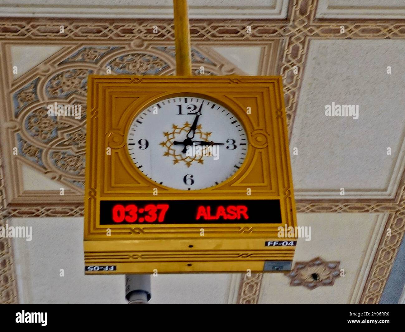 A clock in Al Masjid al-Haram, the Sacred Mosque or the Great Mosque of ...