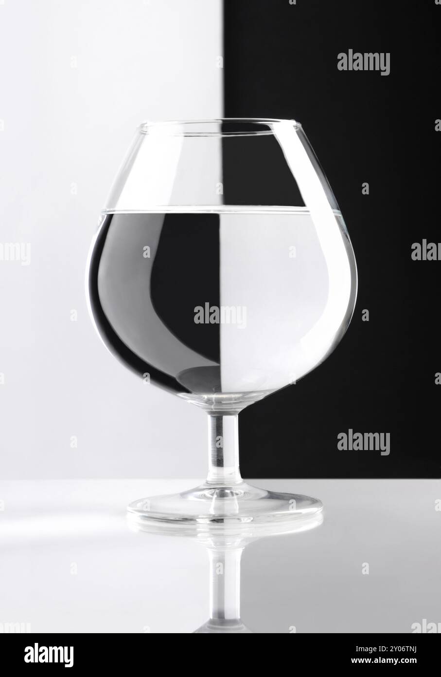 Refraction effect in a glass of water Black and white concept Stock ...