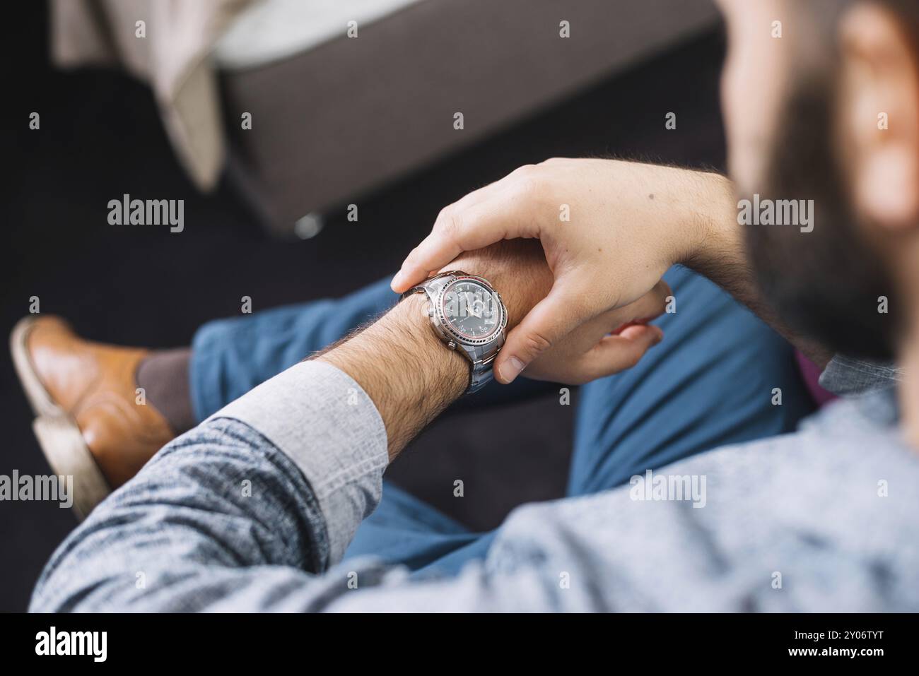 Businessmen checking the time hi-res stock photography and images - Alamy