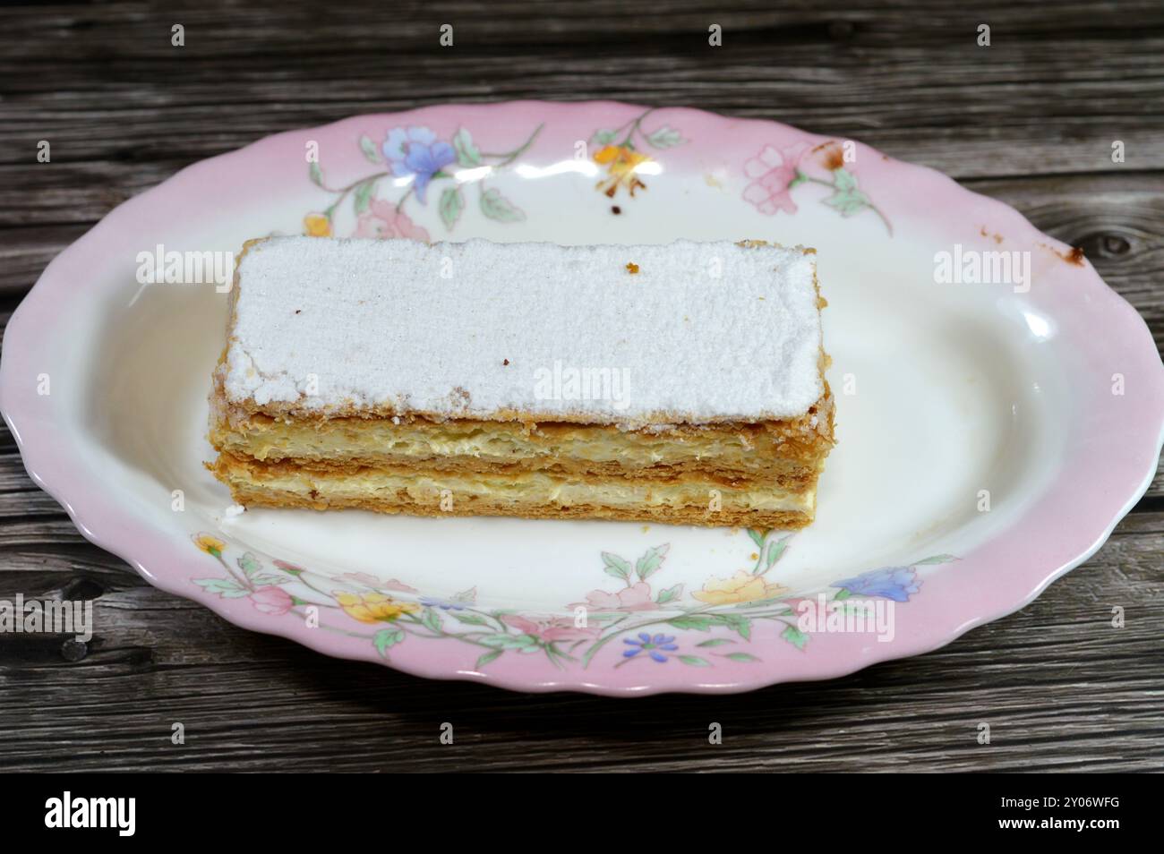 Classic powdered sugar Mille feuille cake gateau made of milk, egg ...
