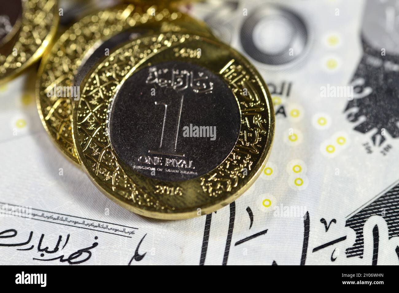 Pile of 1 one Saudi Arabia riyal coin currency features king Salman on ...