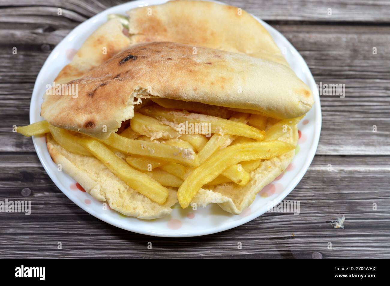 Potatoes with Tahini in Flat Shami Syrian bread filled with French ...