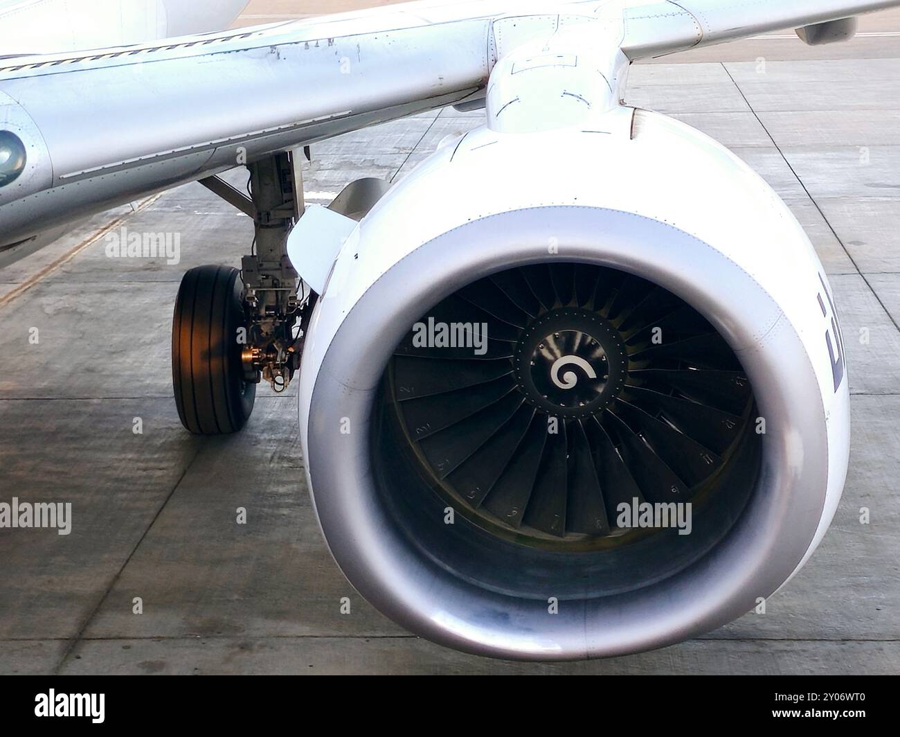 Cairo, Egypt, June 3 2024: Engine and wheels of an airplane, aeroplane ...