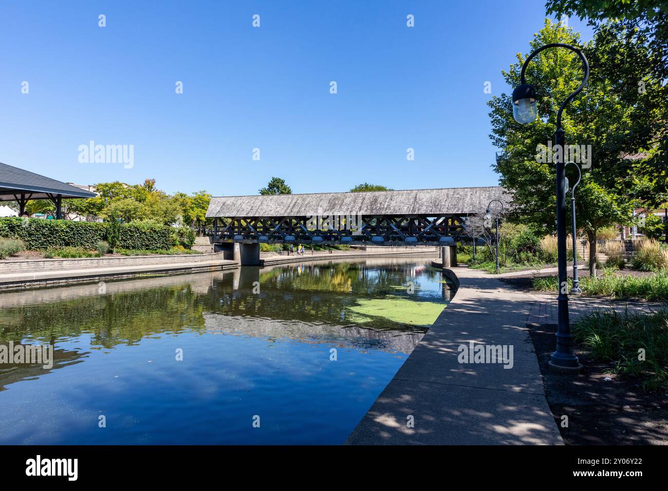 Naperville Riverwalk with covered bridge over the Dupage River Stock ...