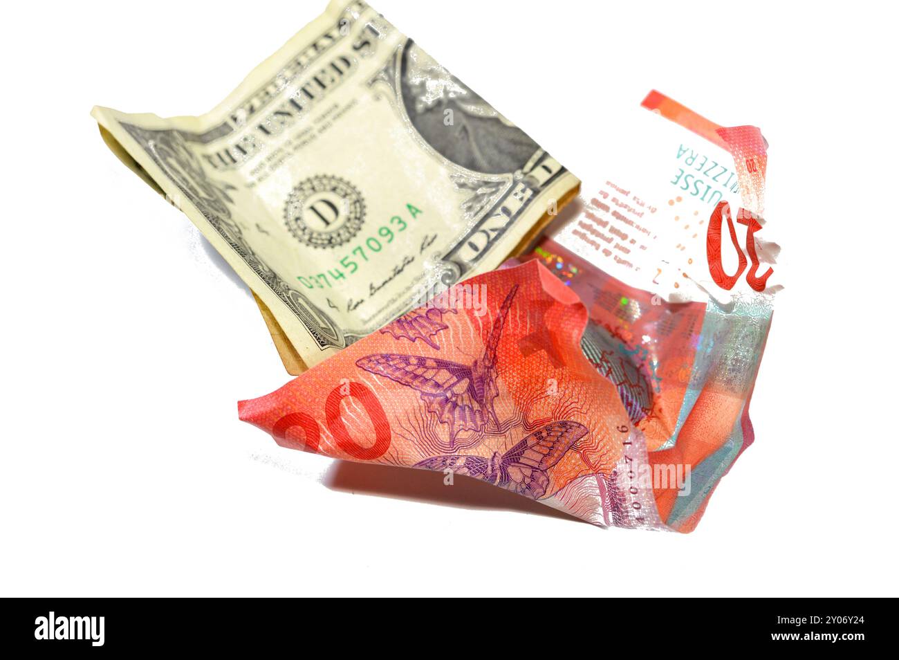 American USD dollar crumpled banknote with Swiss CHF francs wrinkled ...