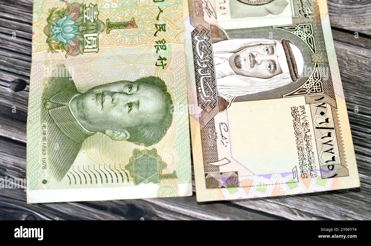 Saudi Arabian riyal bill and 1 one Chinese Yuan cash money bill ...