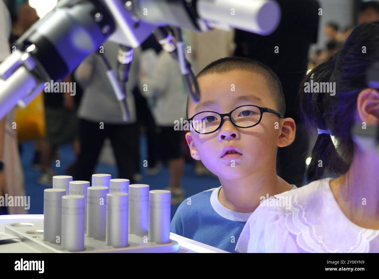 Chengdu, China's Sichuan Province. 1st Sep, 2024. A child watches a ...