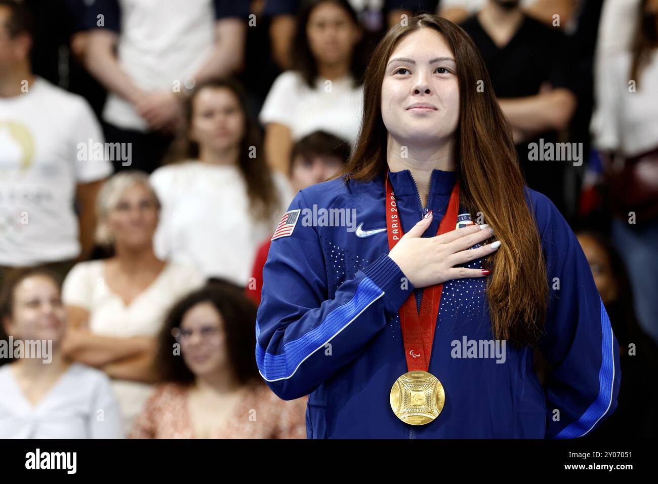 Gia Pergolini from the U.S. stands on the podium with her gold medal ...