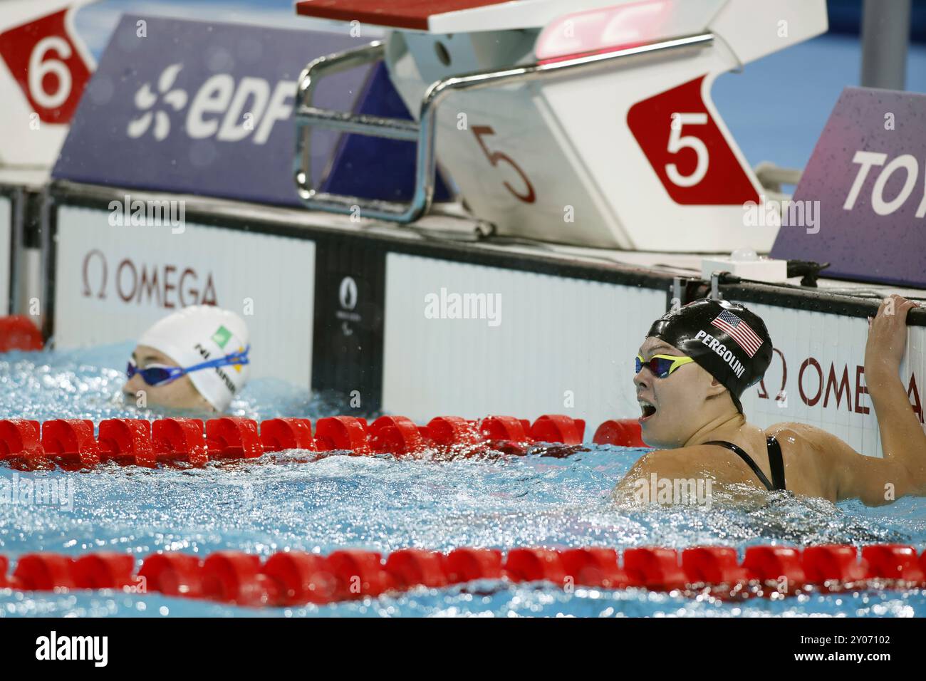 Gia Pergolini from the U.S. emerges from the looks up after winning the ...