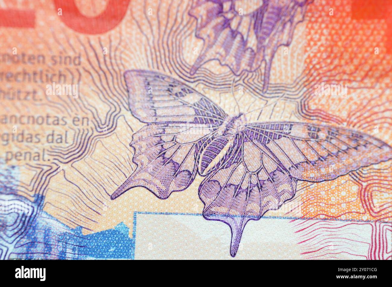 A closeup of Switzerland 20 Twenty Francs, butterflies, a light ...