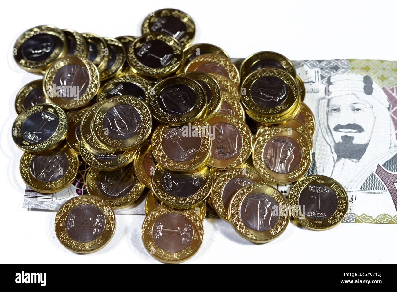 Pile of 1 one Saudi Arabia riyal coin currency features king Salman on ...
