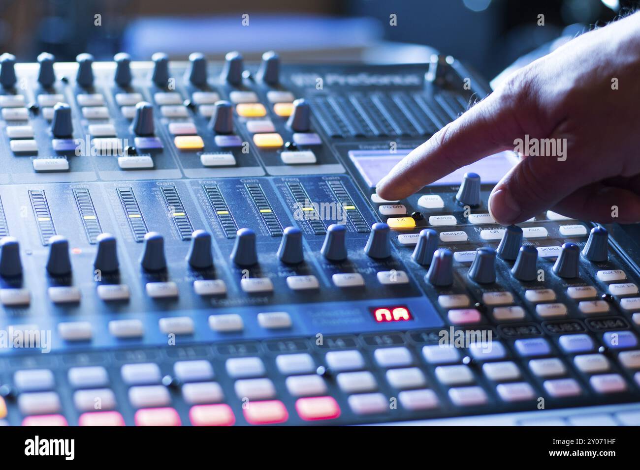Professional music production in a sound recording studio, mixer desk ...