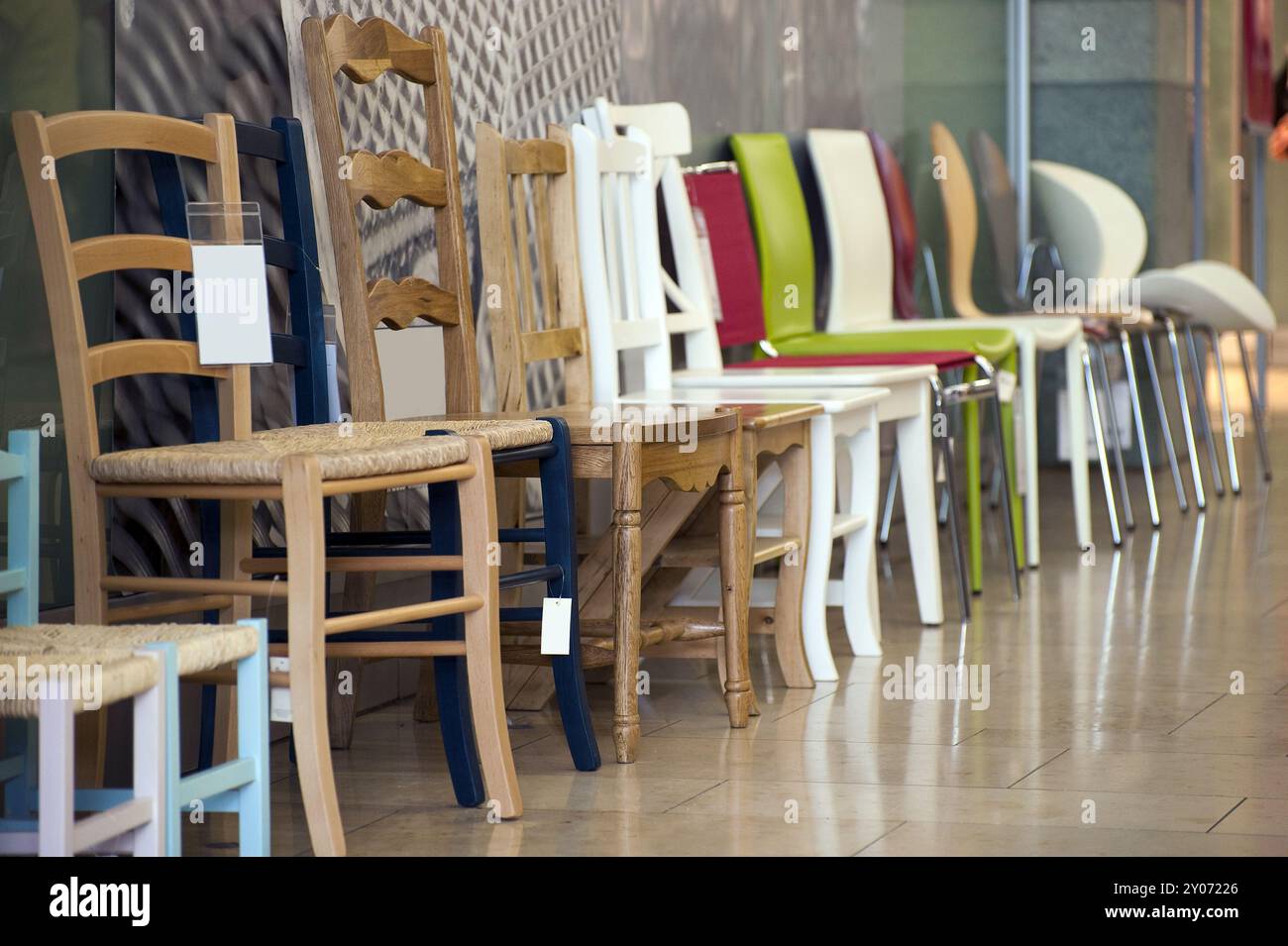 Different chairs are lined up in a row Stock Photo - Alamy