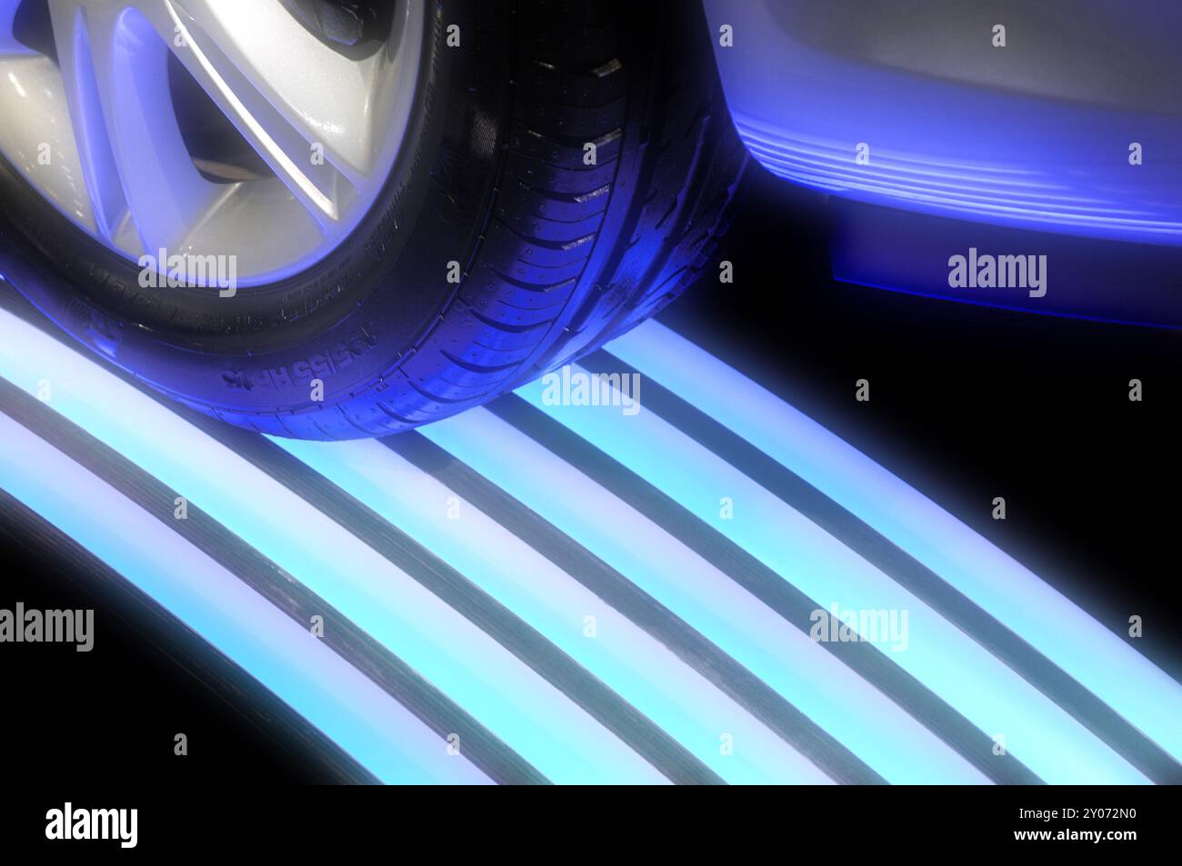 Stock photo of a Car wheel illuminated with blue light coming from ...