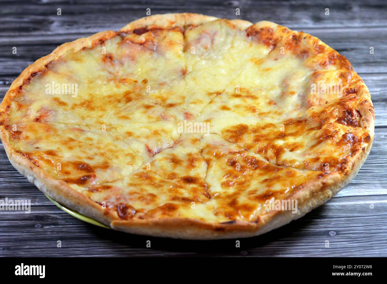 Pizza Margherita, a typical Neapolitan pizza, roundish in shape with a ...