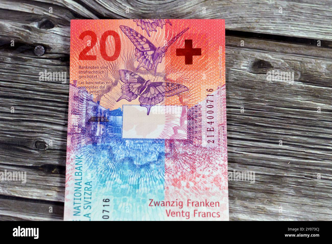 reverse side of Switzerland 20 Twenty Francs, butterflies, a light ...