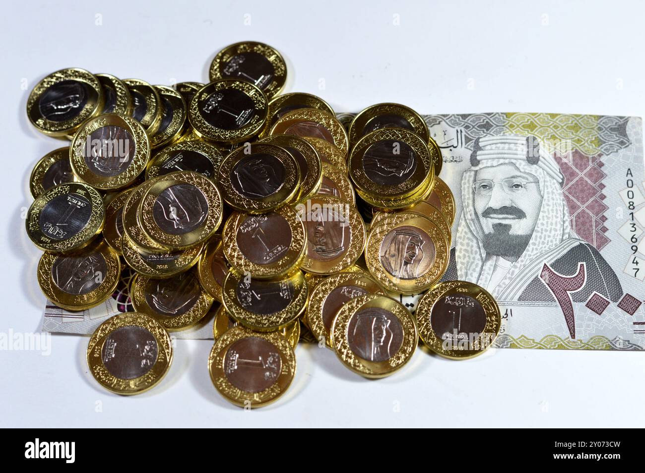 Pile of 1 one Saudi Arabia riyal coin currency features king Salman on ...