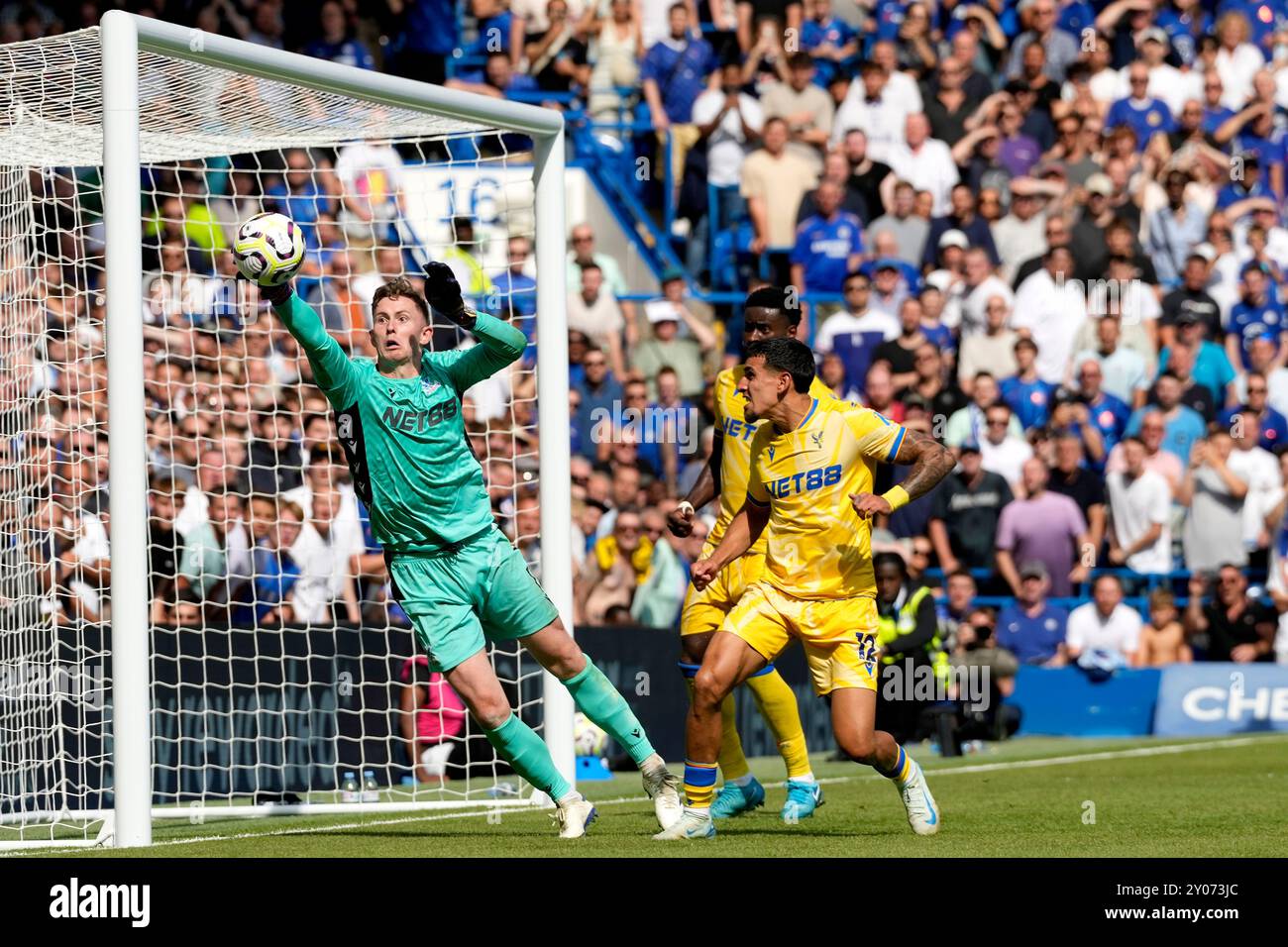 Crystal Palace's goalkeeper Dean Henderson, left, makes a save during ...