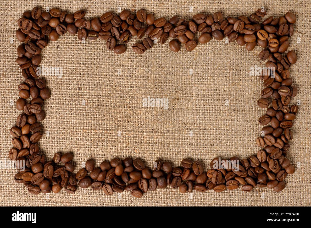 Horizontal frame made from aromatic coffee beans on sacking fabric ...