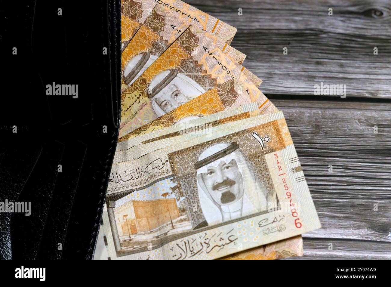 Saudi Arabian Riyals bills banknotes, pile of SAR riyal cash money ...