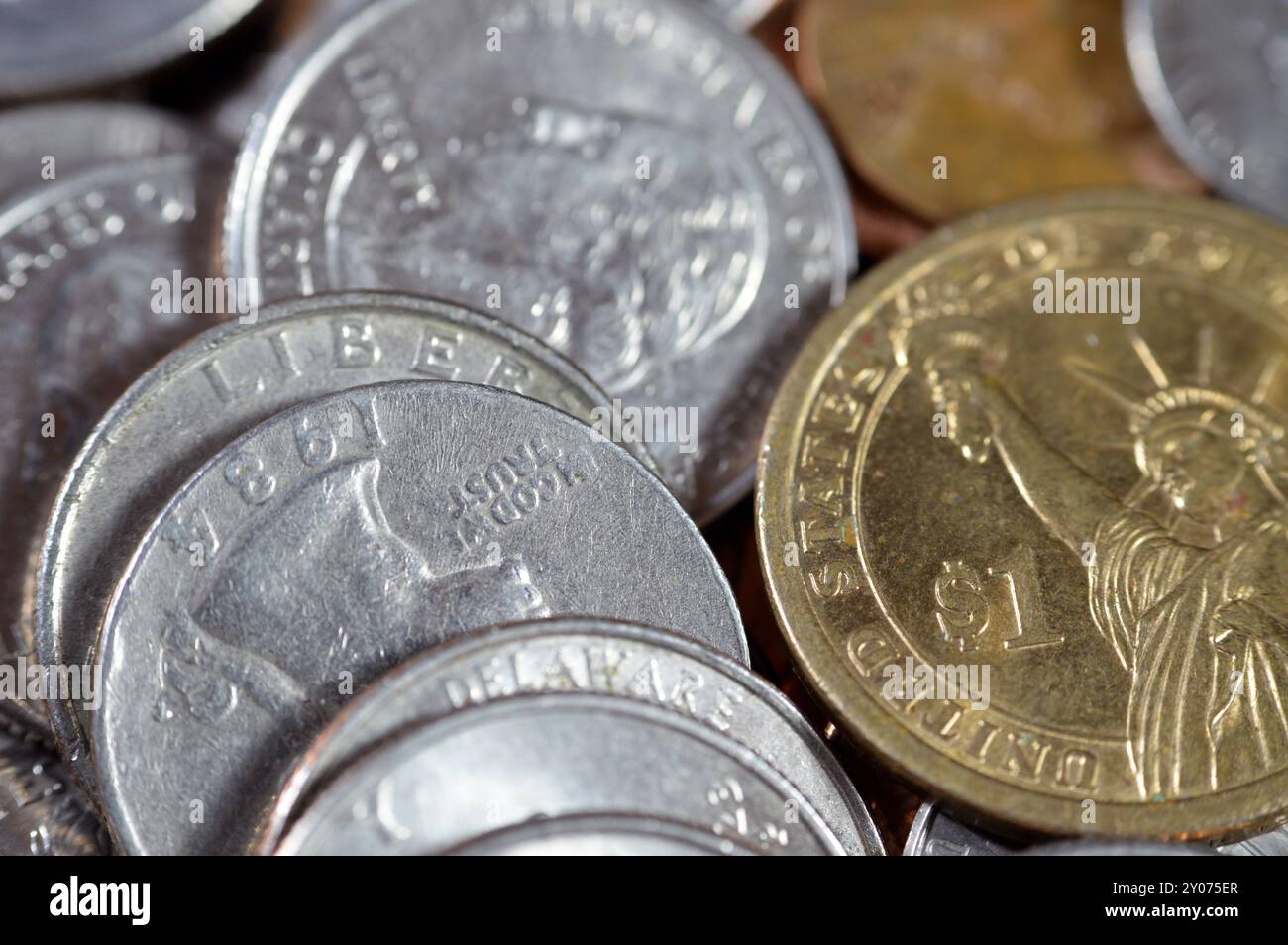 Pile of American coins of 1 cent, 5, 10, 25 cents quarter and one ...
