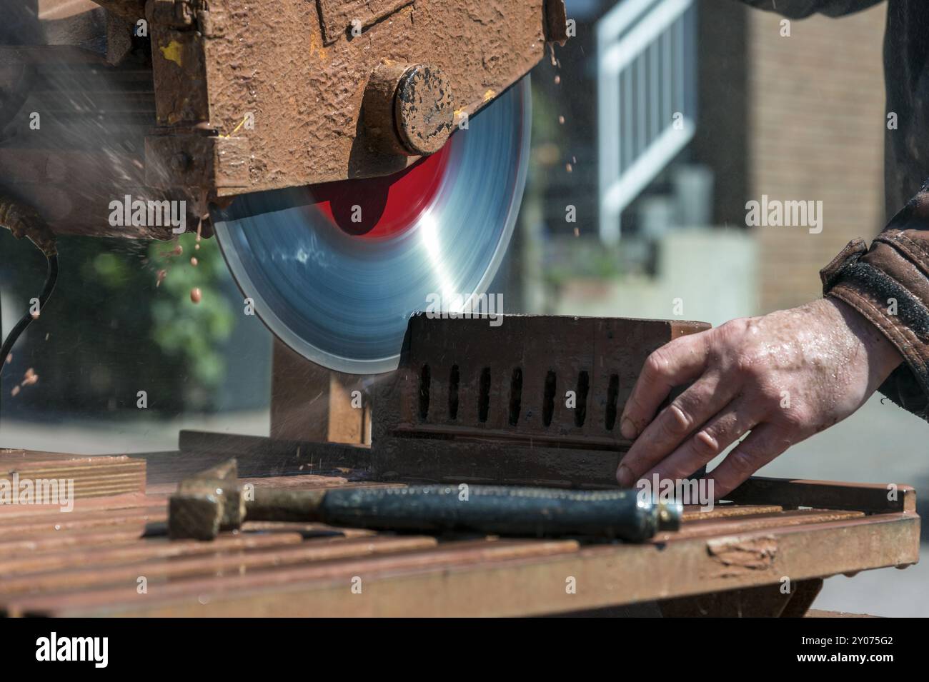 Rotating saw blade of a stone cutting machine at work Stock Photo - Alamy