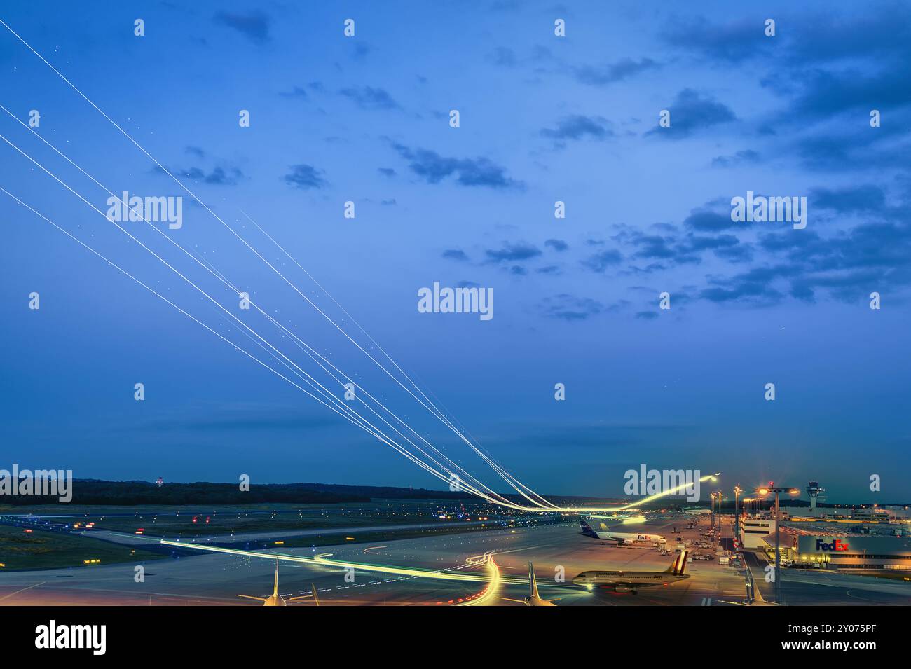 Take-offs, landings and airfield traffic during the blue hour at the ...
