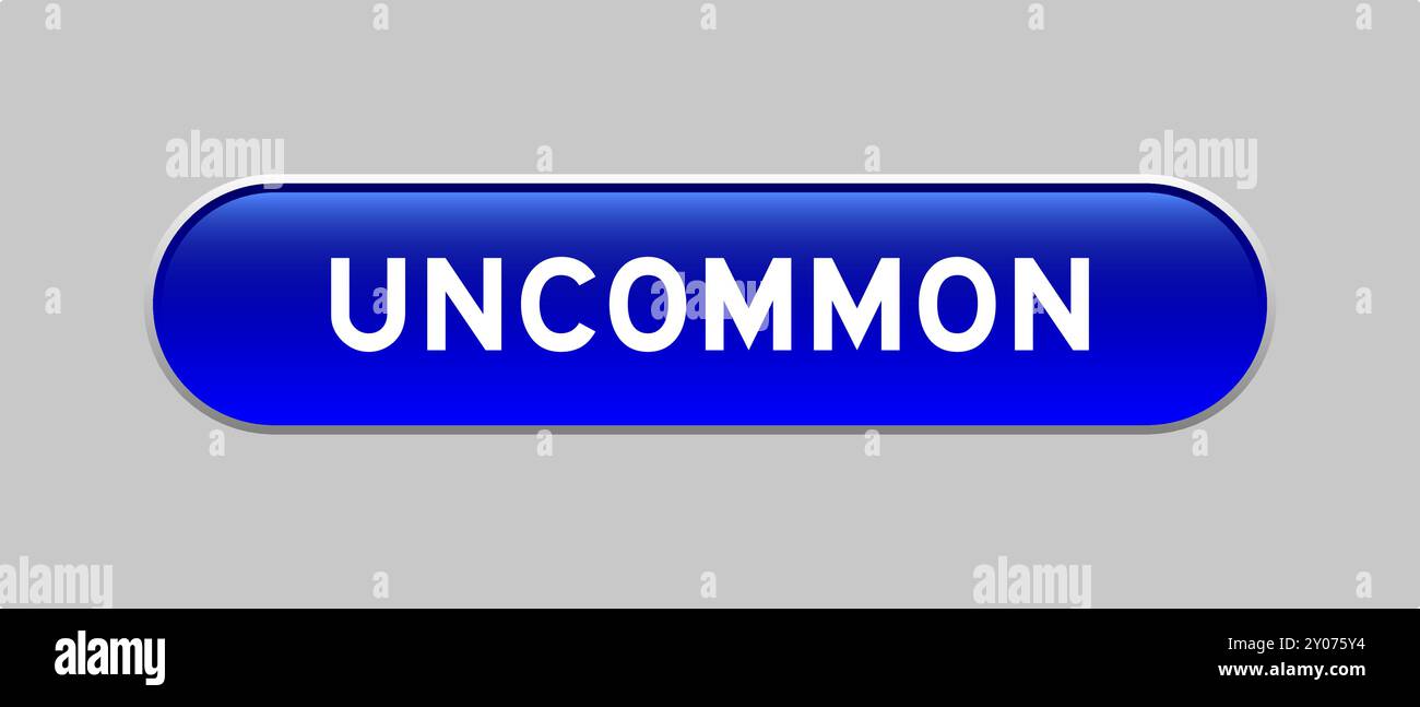 Blue color capsule shape button with word uncommon on gray background ...