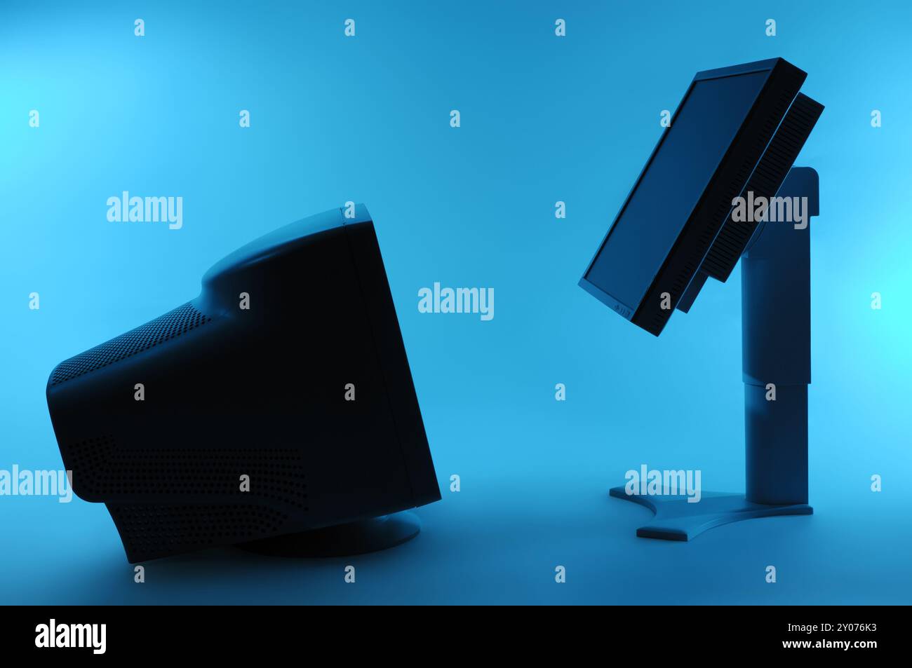 Old CRT monitor looking up at a brand new modern LCD display Technology ...