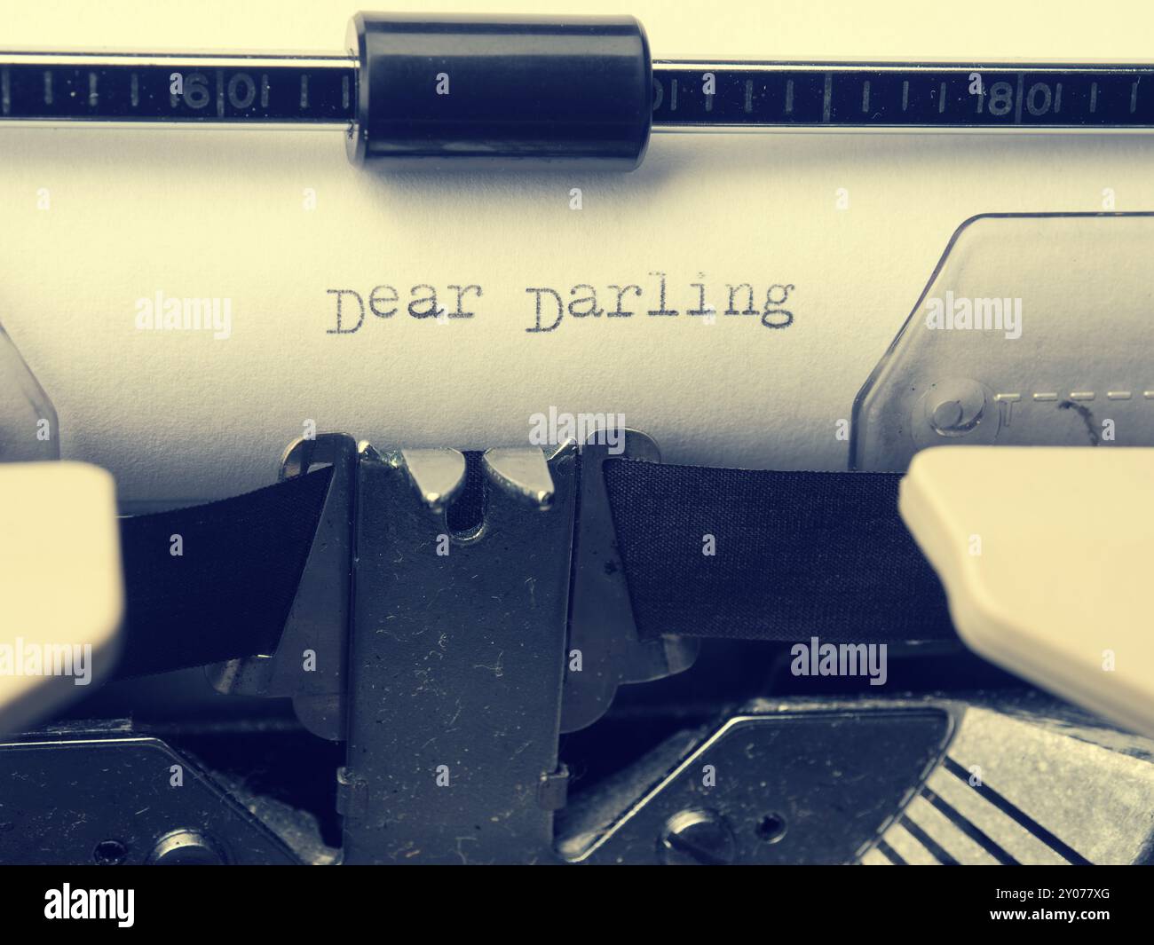 Close up of an old typewriter with a vintage letter with the words Dear ...