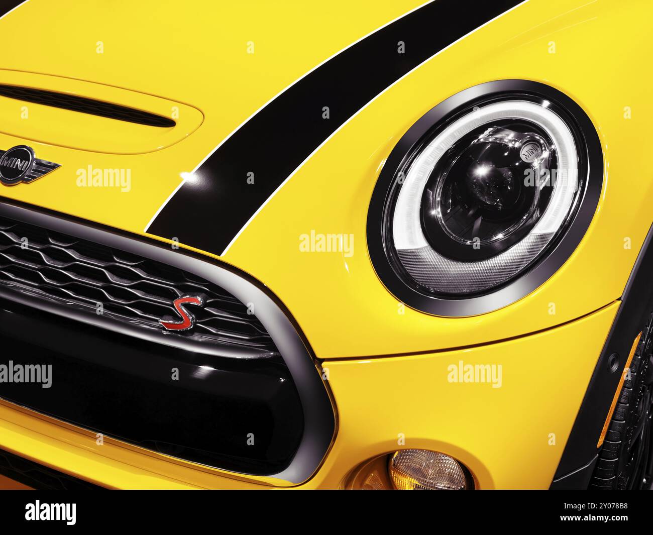 Yellow 2014 Mini Cooper S closeup of car detail, headlight and hood ...