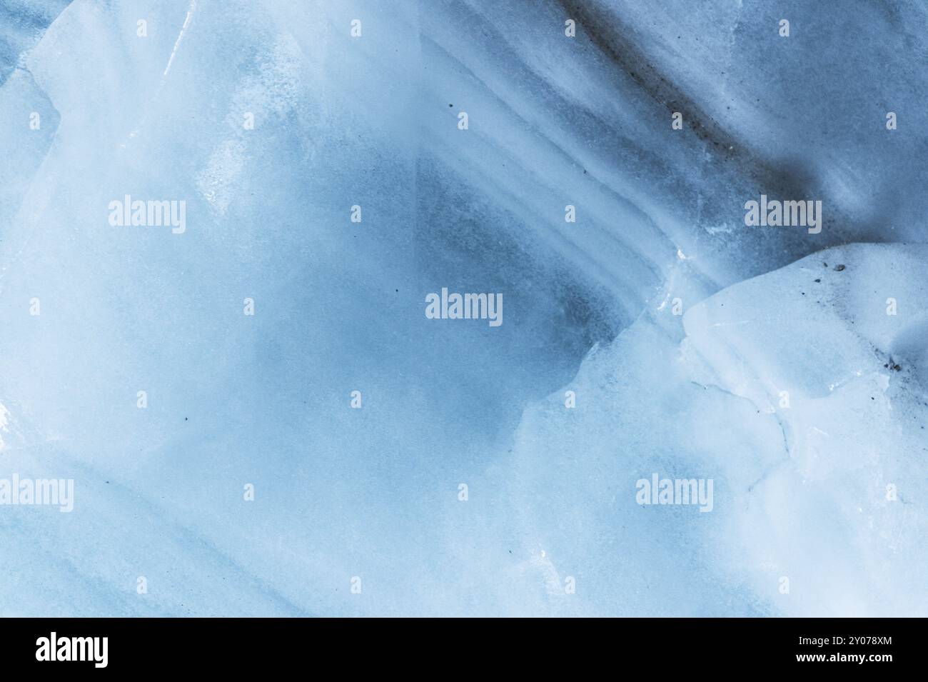 Close-up wall of a centuries-old glacier with a structure of stripes ...