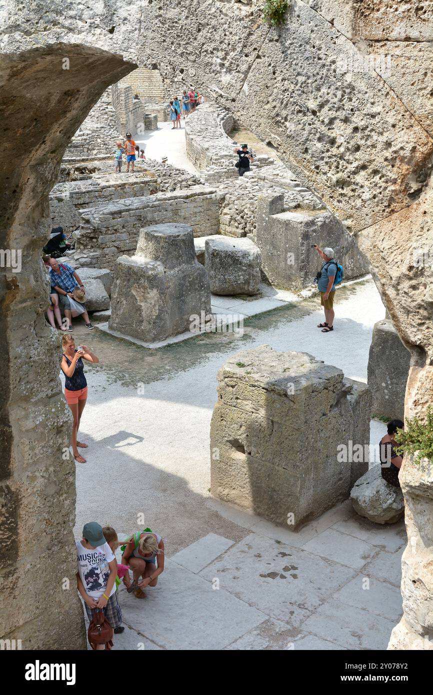 Tourists visiting the Arena, the landmark in the historic centre of ...