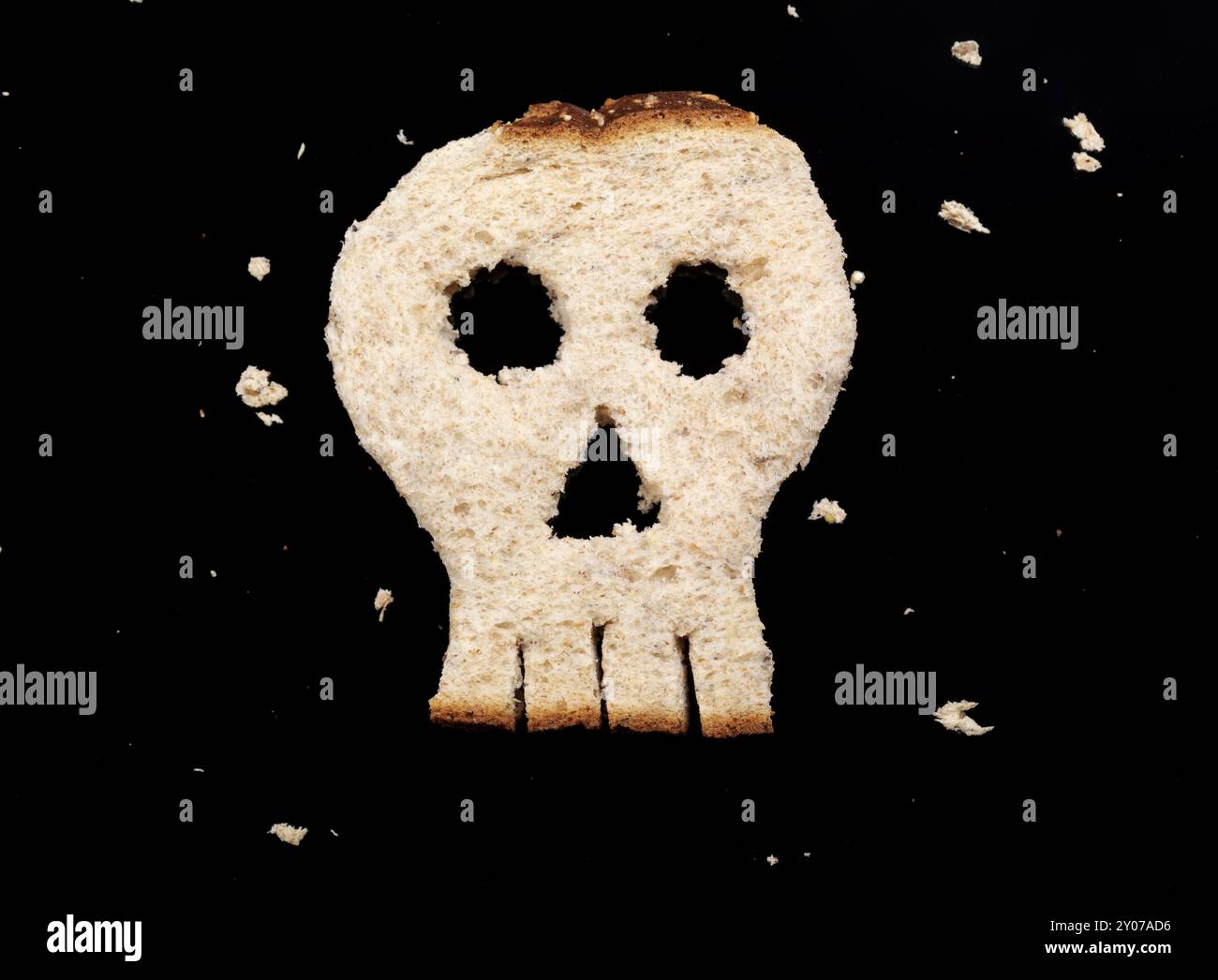 Skull made of bread isolated on black background Stock Photo - Alamy