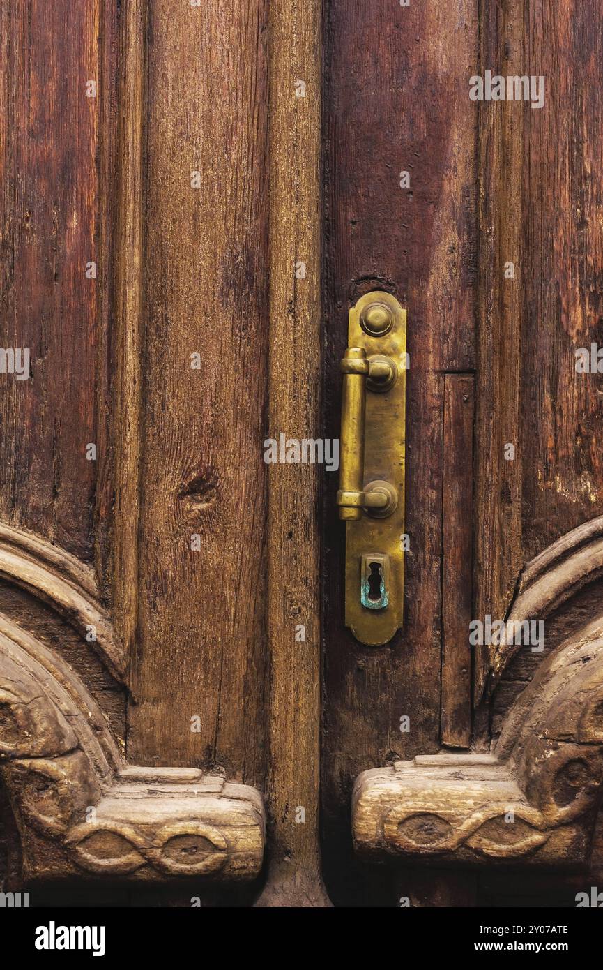 Vintage background. Brass-made old handle with Elements of an carved ...