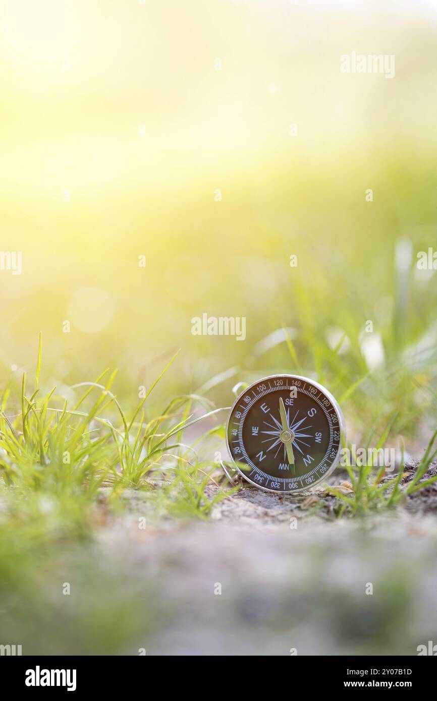 Vintage compass lying on the floor. Adventure and discovery concept ...
