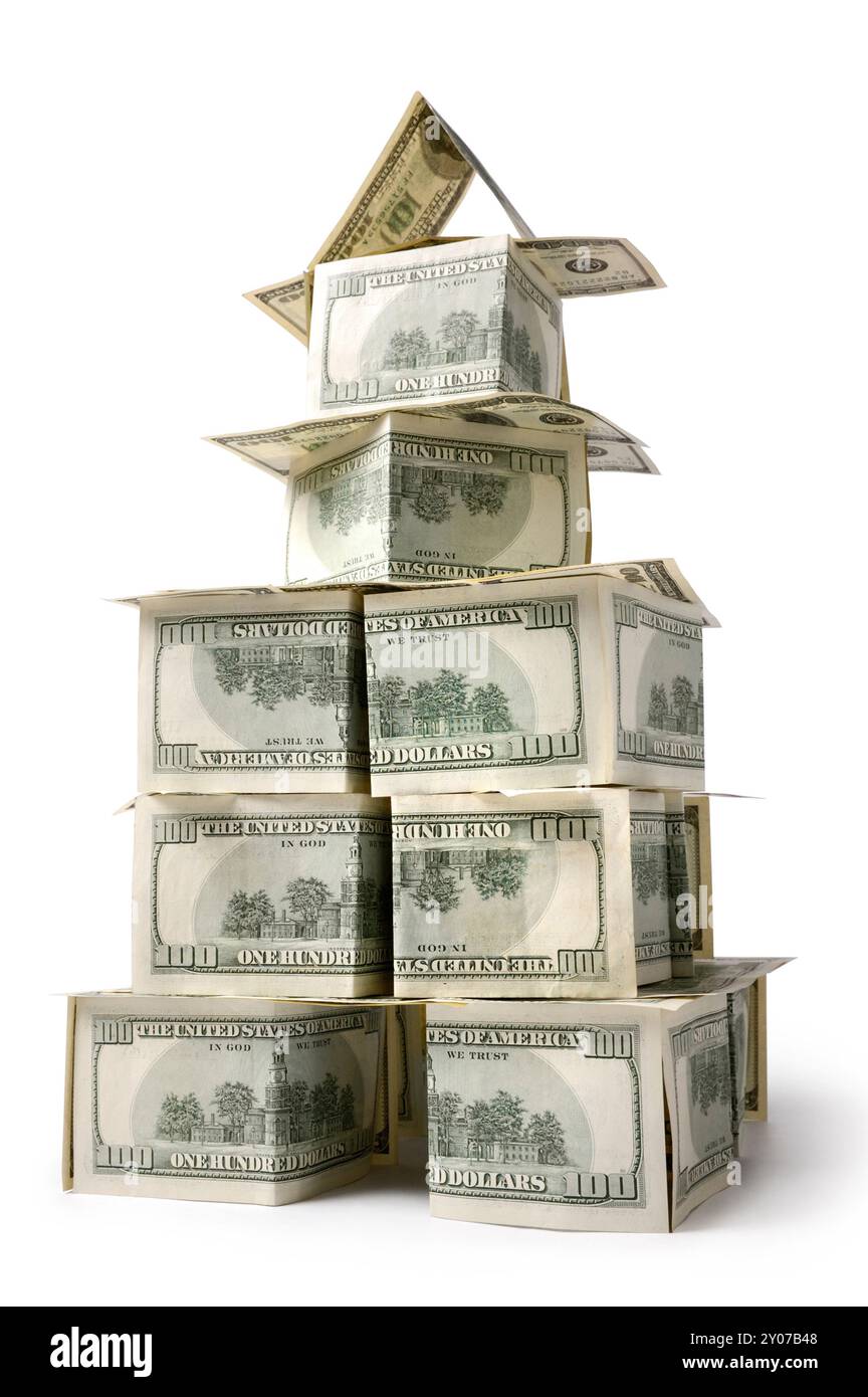 Tower made from dollar bills. Isolated on white background with ...