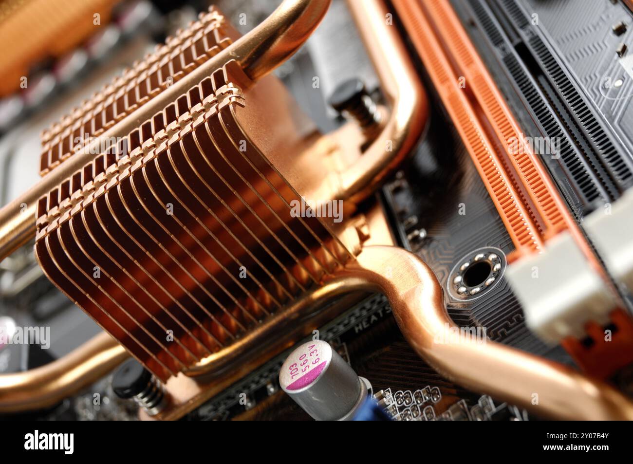 Copper heatsink radiator cooler on a computer motherboard Stock Photo ...