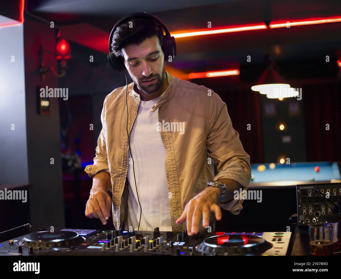 Male DJ playing music in club . Nightlife and disco concept Stock Photo ...