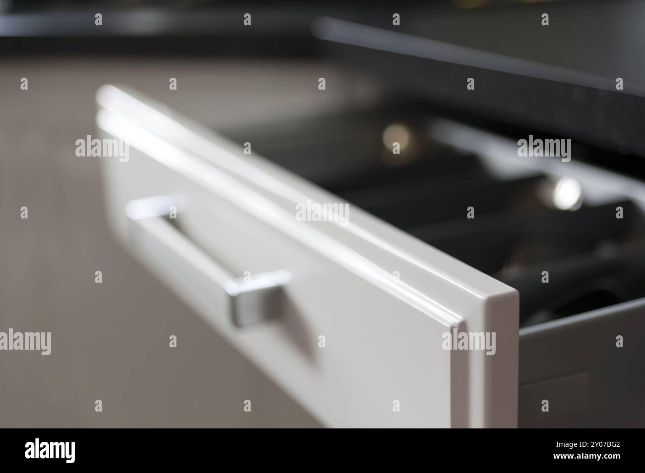 Open kitchen drawer with cutlery tray Stock Photo - Alamy