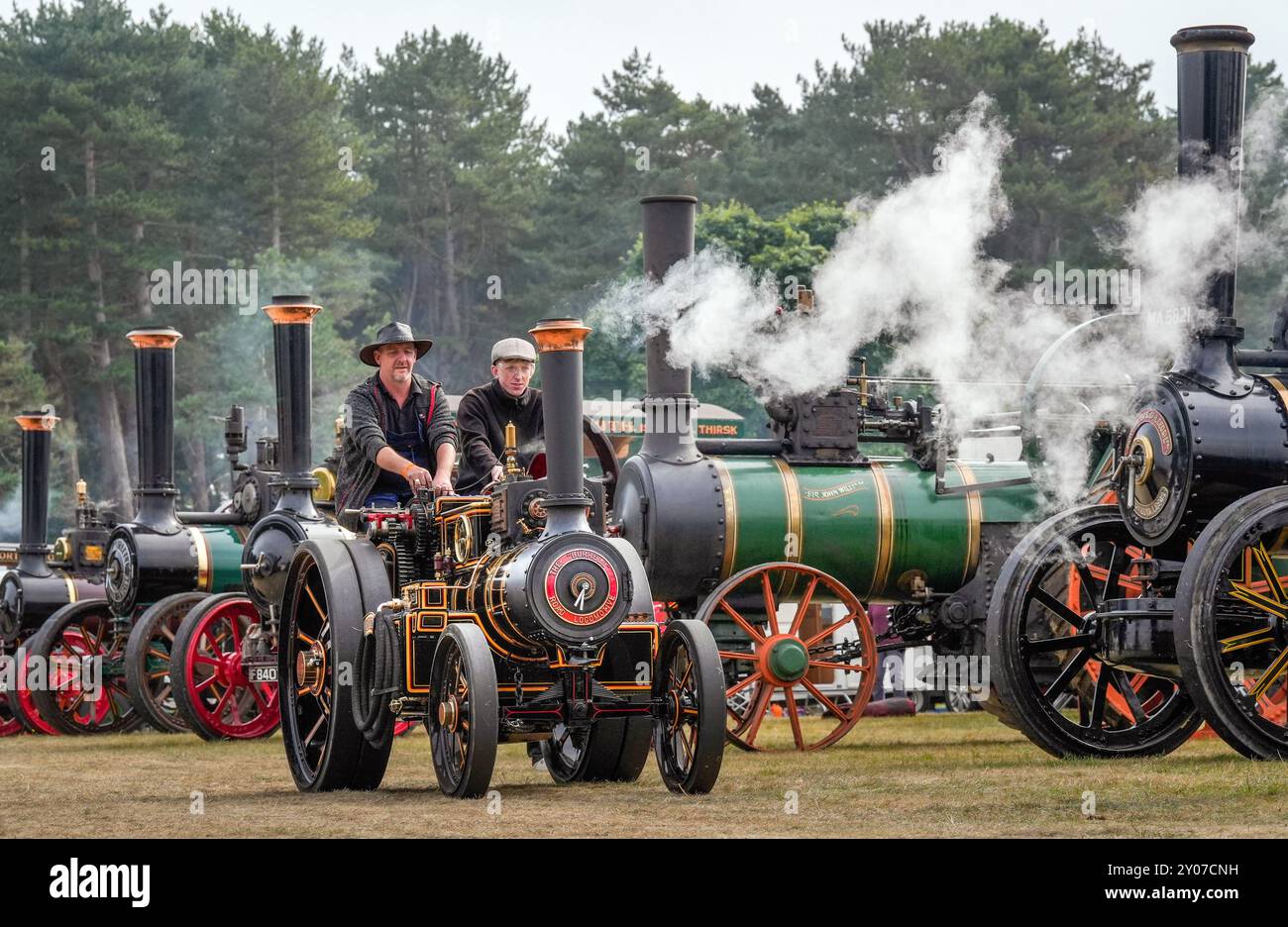 Dave Davis (left) and George Venn (right) drive a Burrell double crank ...