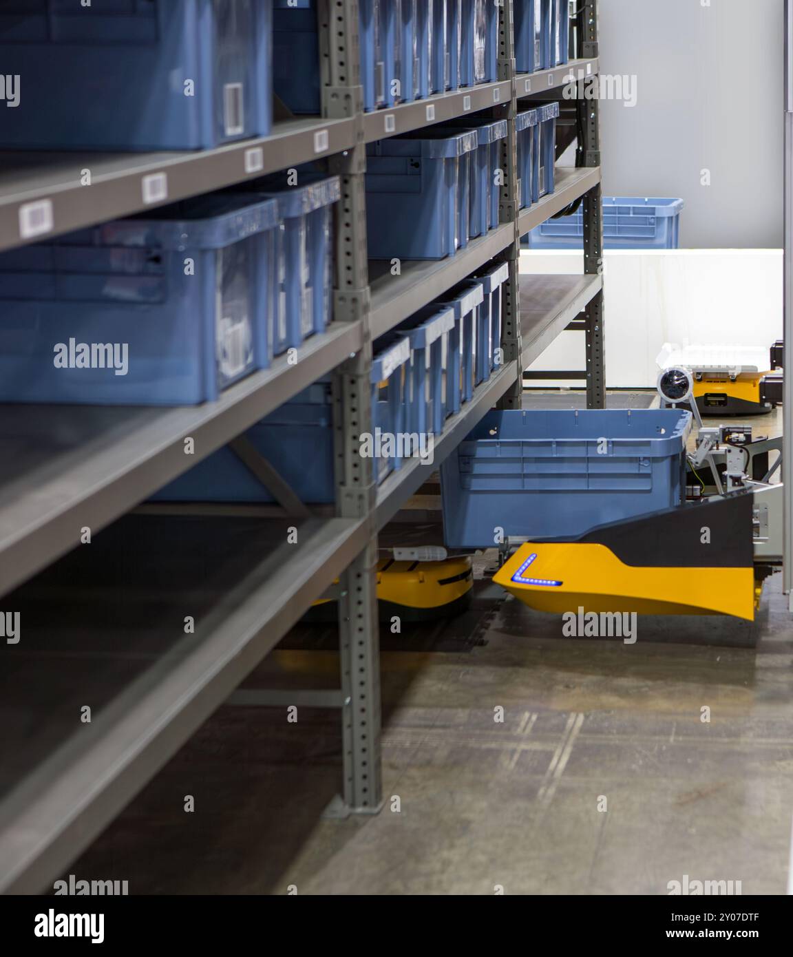 Autonomous robot picking materials from multi-layer rack in modern ...